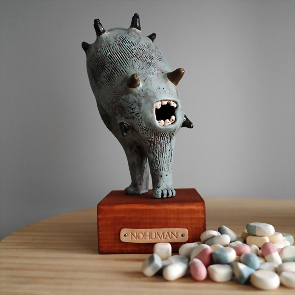 Blue monster taking medicine